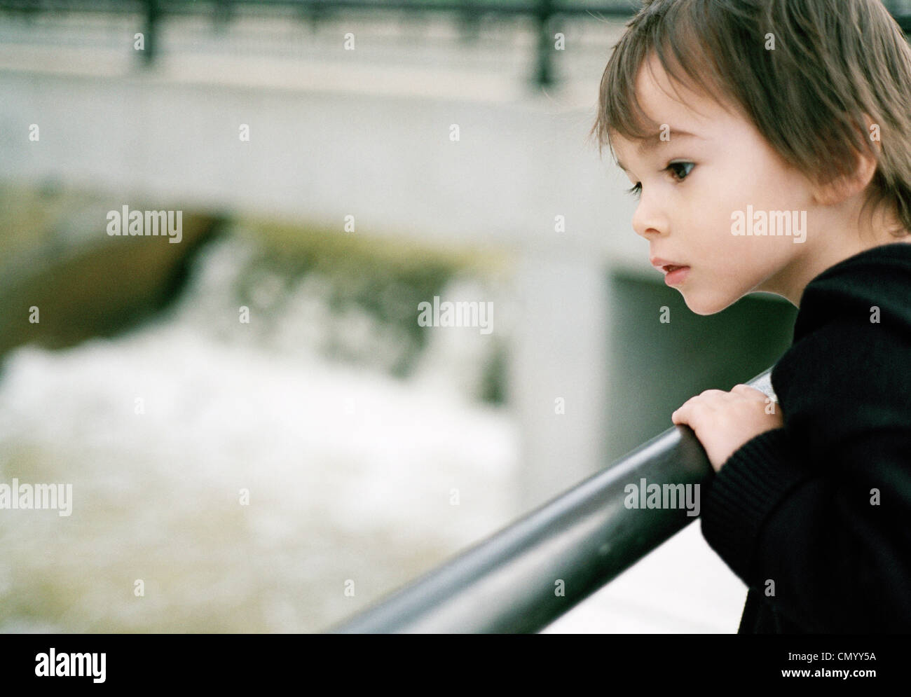 Toddler Looking over a Railing Stock Photo - Alamy