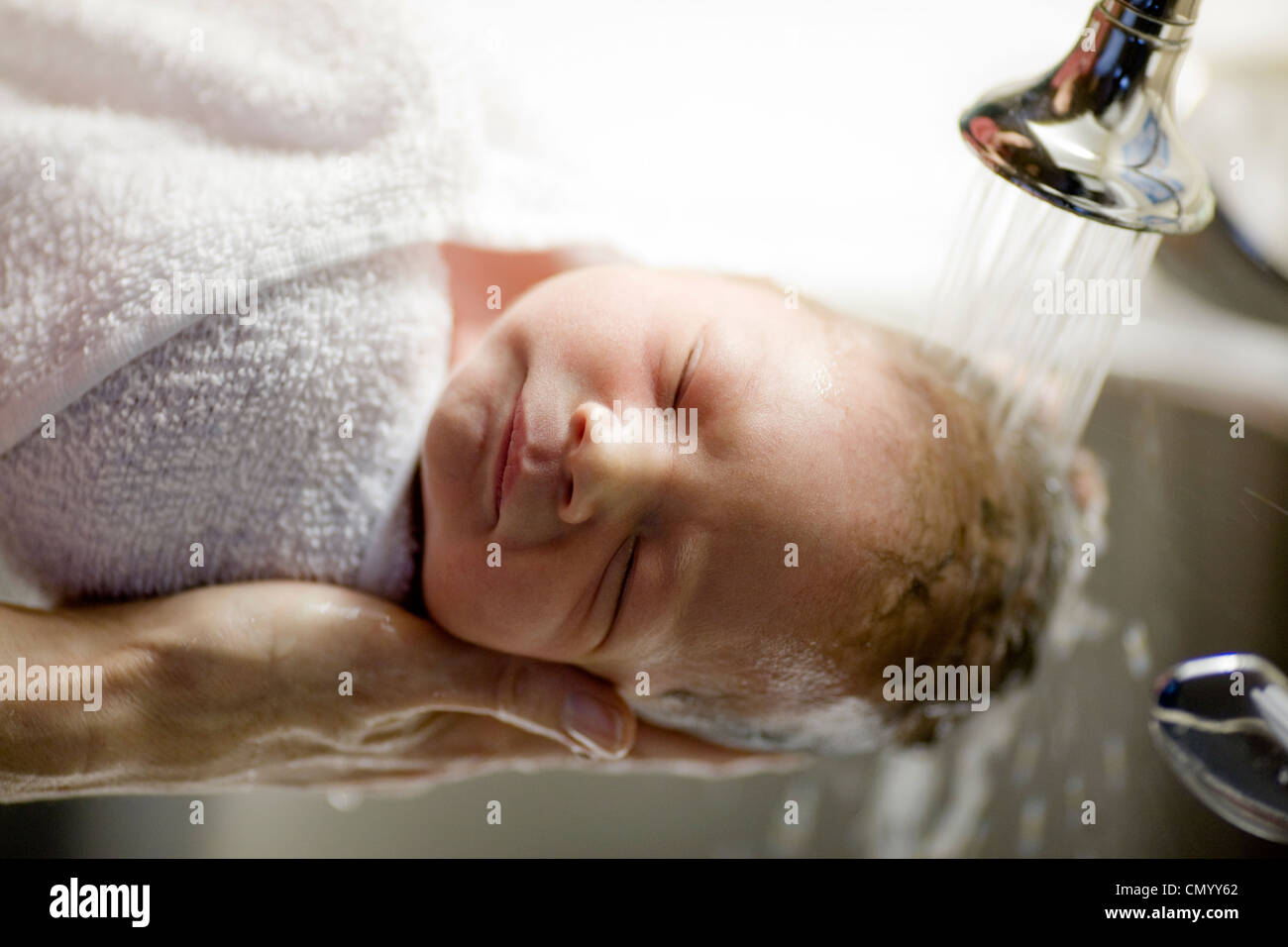 Newborn Baby Boy being Washed for the first time at the Hospital Stock ...