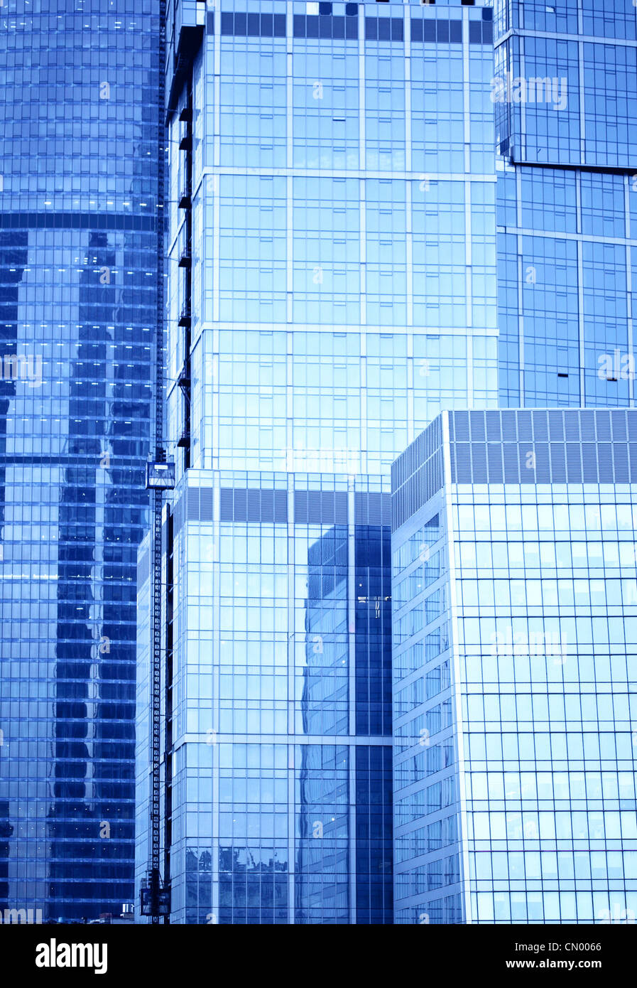 Modern skyscrapers close-up toned in blue color Stock Photo - Alamy