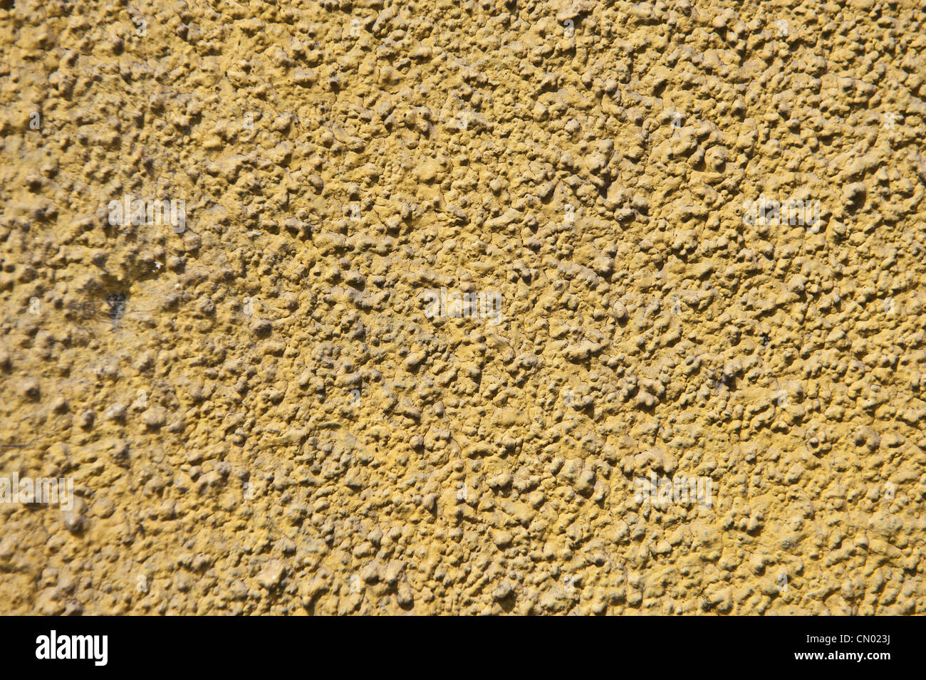 Sandy brown, bumpy texture of a stucco building Stock Photo - Alamy