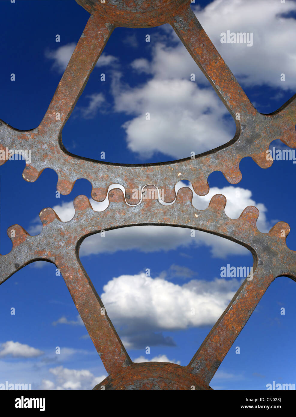Rusty cogs against a sky background Stock Photo - Alamy