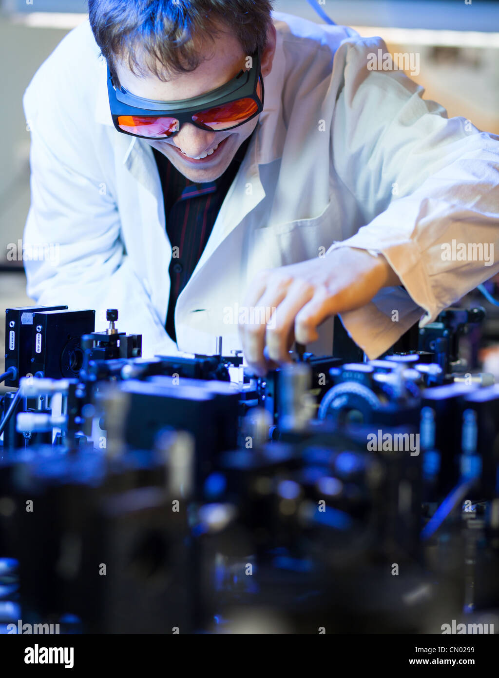 scientist doing research in a quantum optics lab (shallow DOF; color ...