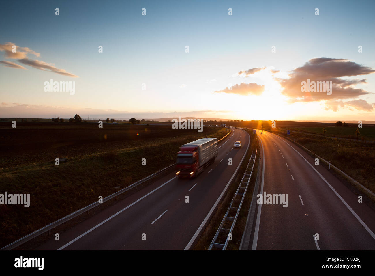highway traffic - motion blurred truck on a highway/motorway/speedway ...