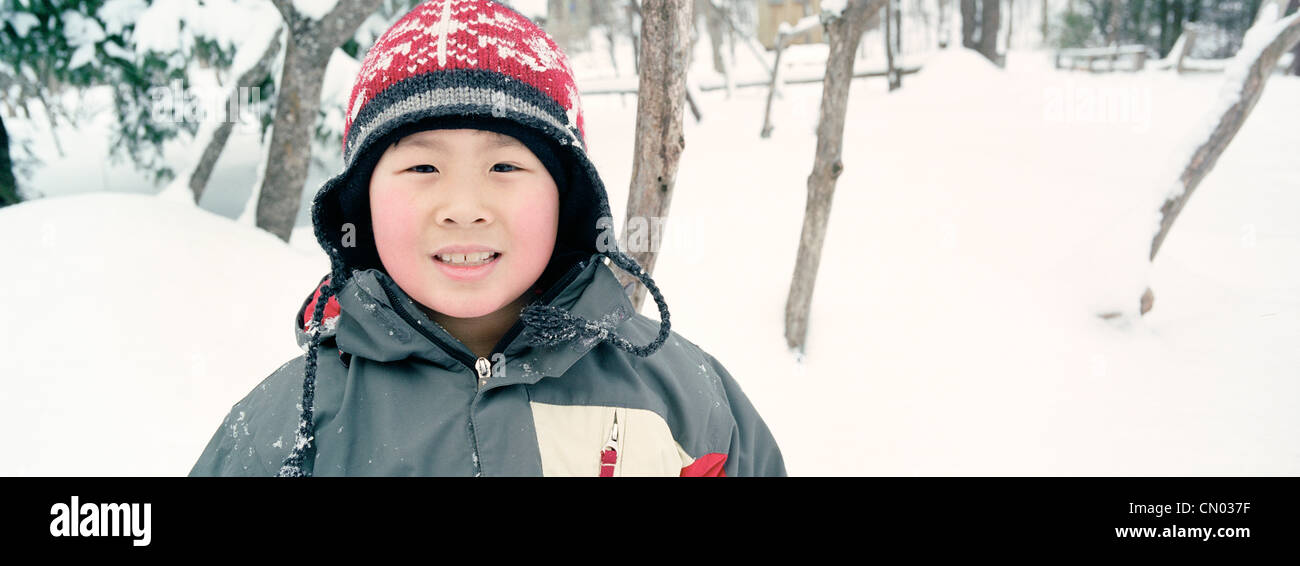Vietnamese Boy wearing Toque with Snow, Montreal, Quebec Stock Photo ...