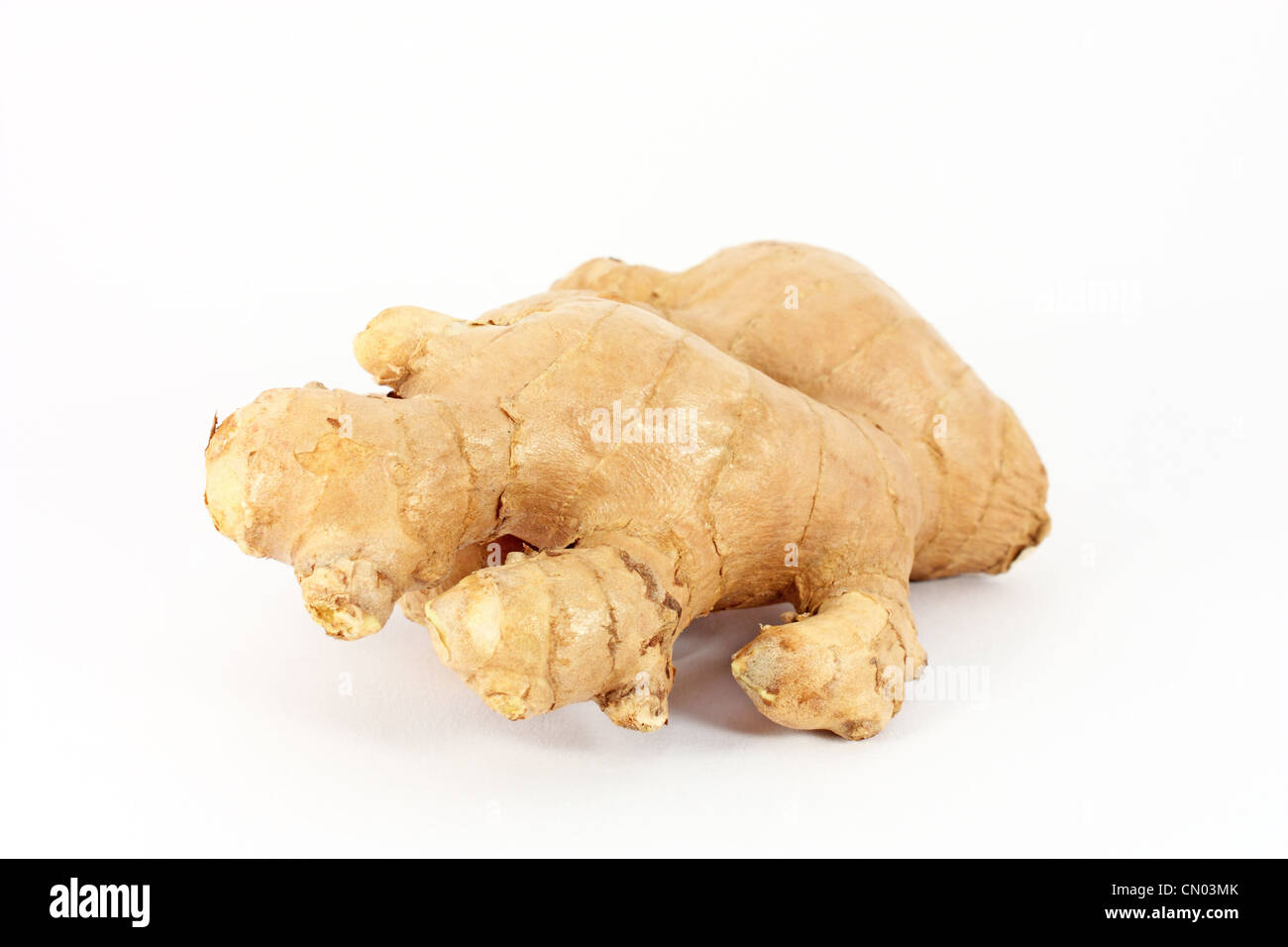Ginger root closeup isolated on white background Stock Photo - Alamy