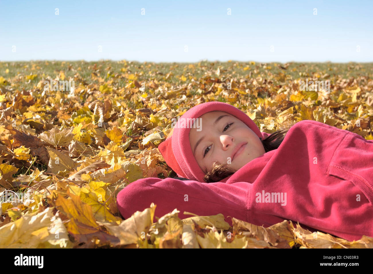 Girl Laying Down in Autumn Leaves, Aurora, Ontario Stock Photo - Alamy