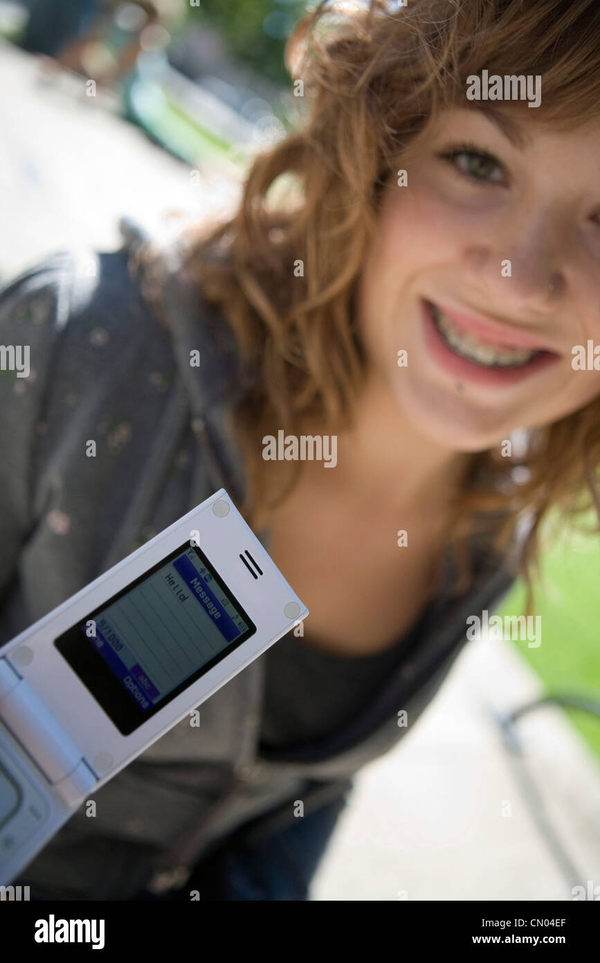 Teenage girl looking text messages hi-res stock photography and images ...