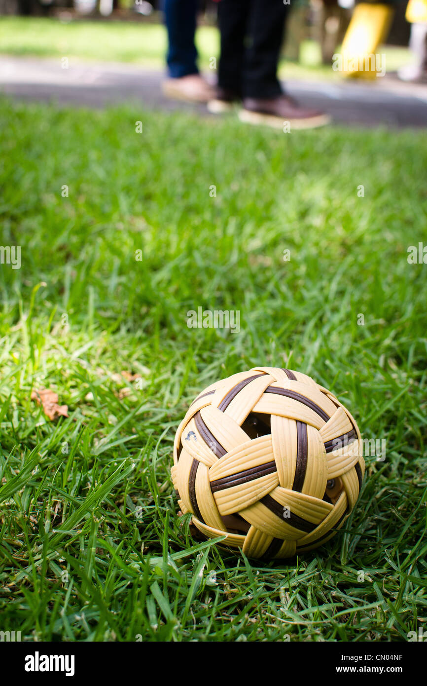 An elastic ball left on the grass in park from Malaysian festival Stock ...
