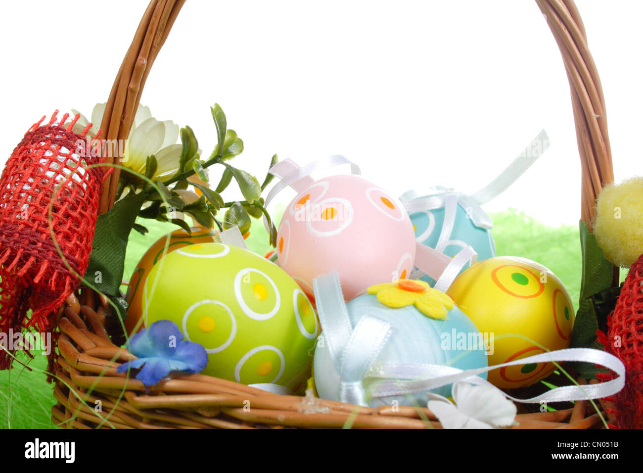 Easter eggs in basket on green Grass Stock Photo - Alamy