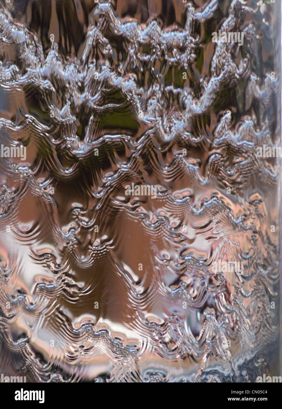Water rippling down a bright shiny mirror Stock Photo - Alamy