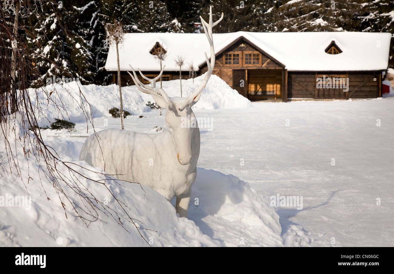 Deer statue in snow Stock Photo - Alamy