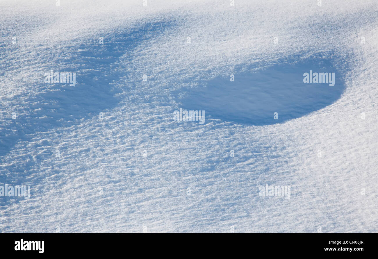 Surface of snow with hole Stock Photo - Alamy