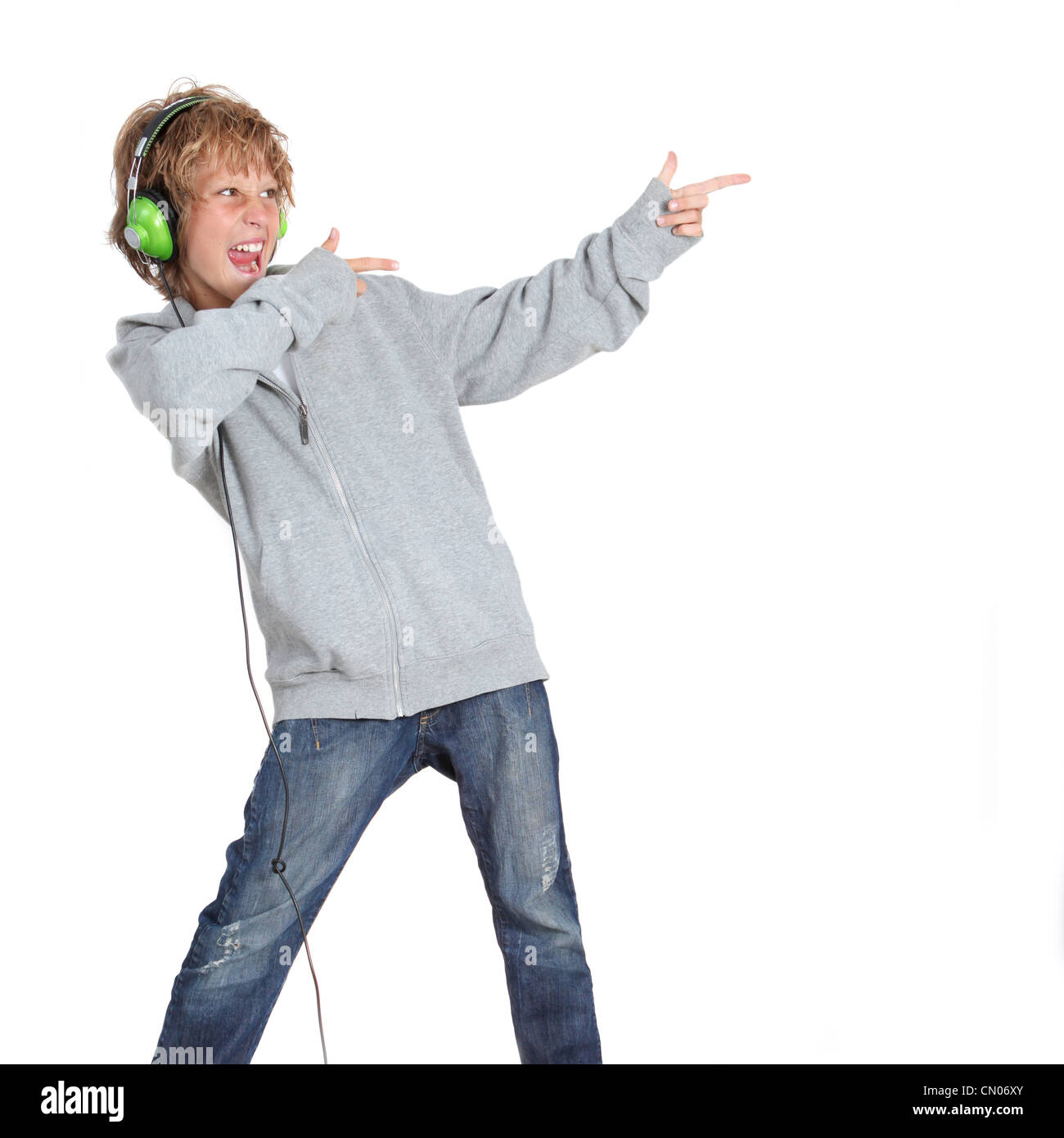 kid pointing and listening to music Stock Photo - Alamy