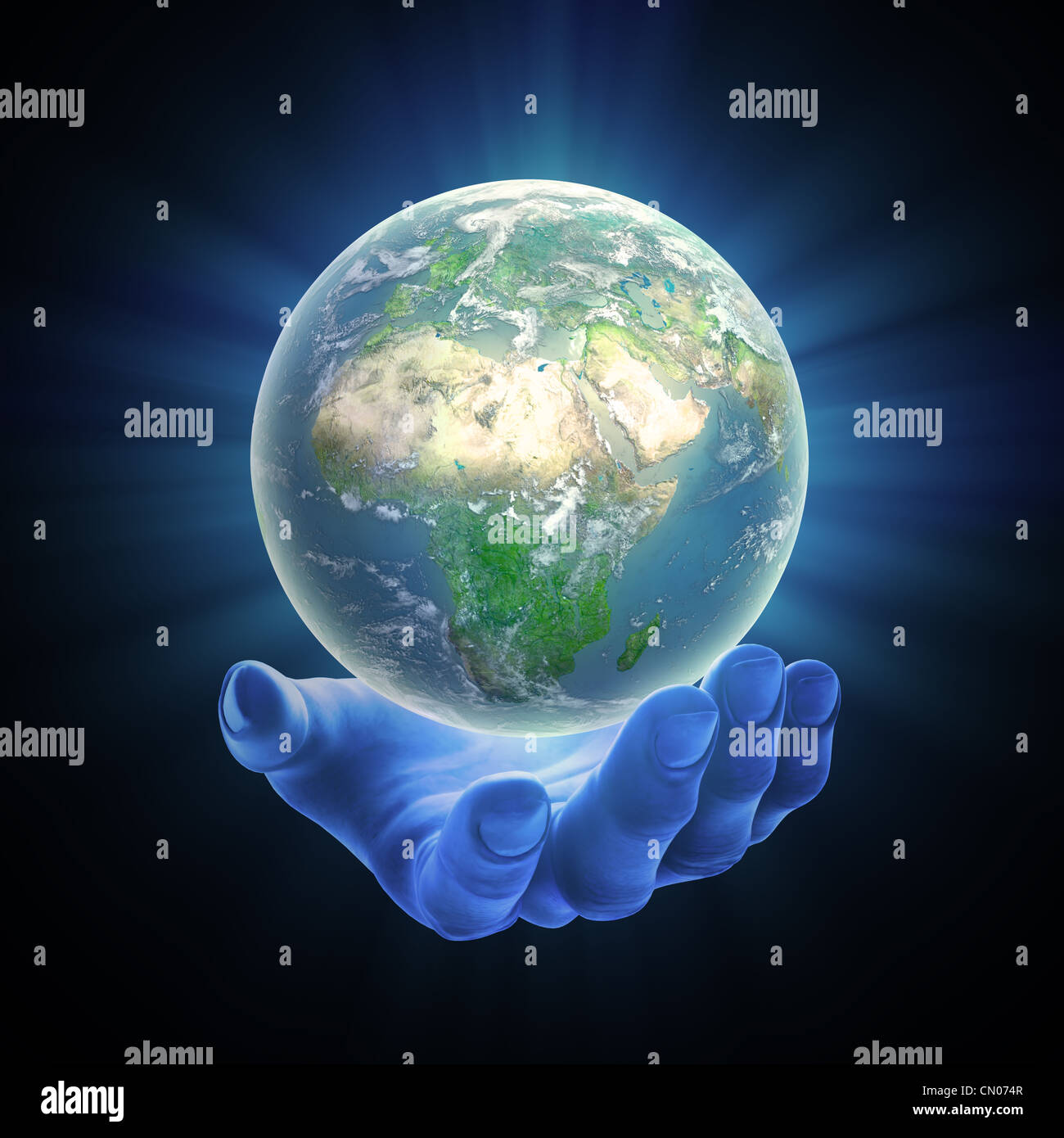An illustrated hand holding a glowing Earth globe Stock Photo - Alamy