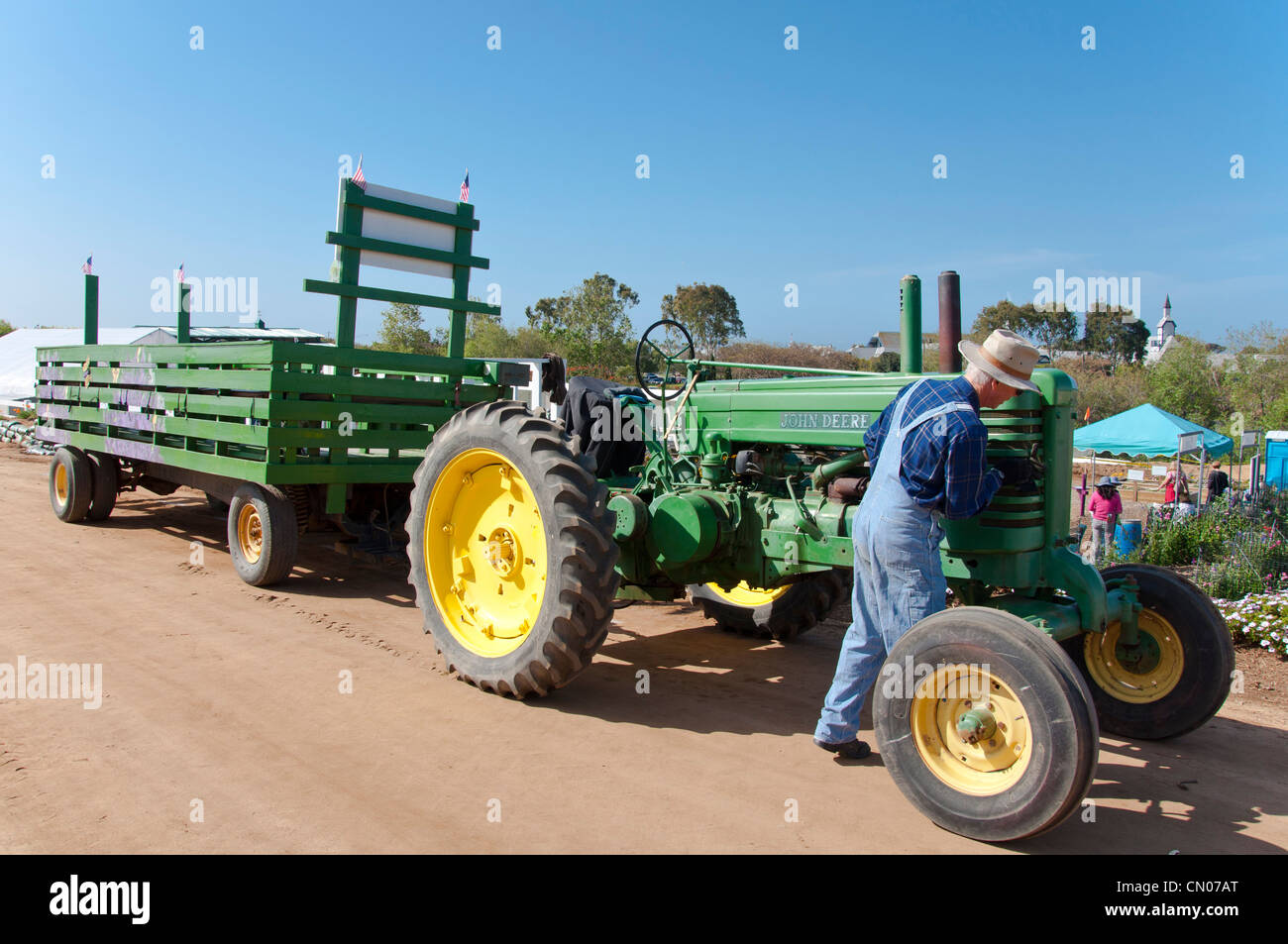 A man fixing tractor Stock Photo - Alamy