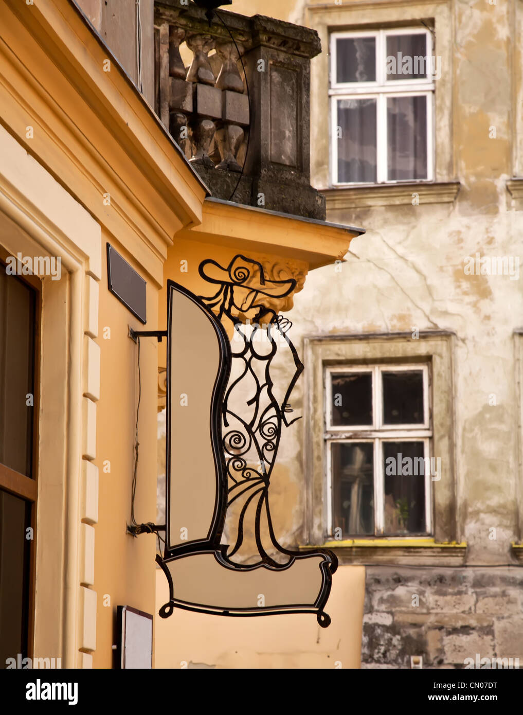 Iron signboard in ancient style with woman figure Stock Photo - Alamy