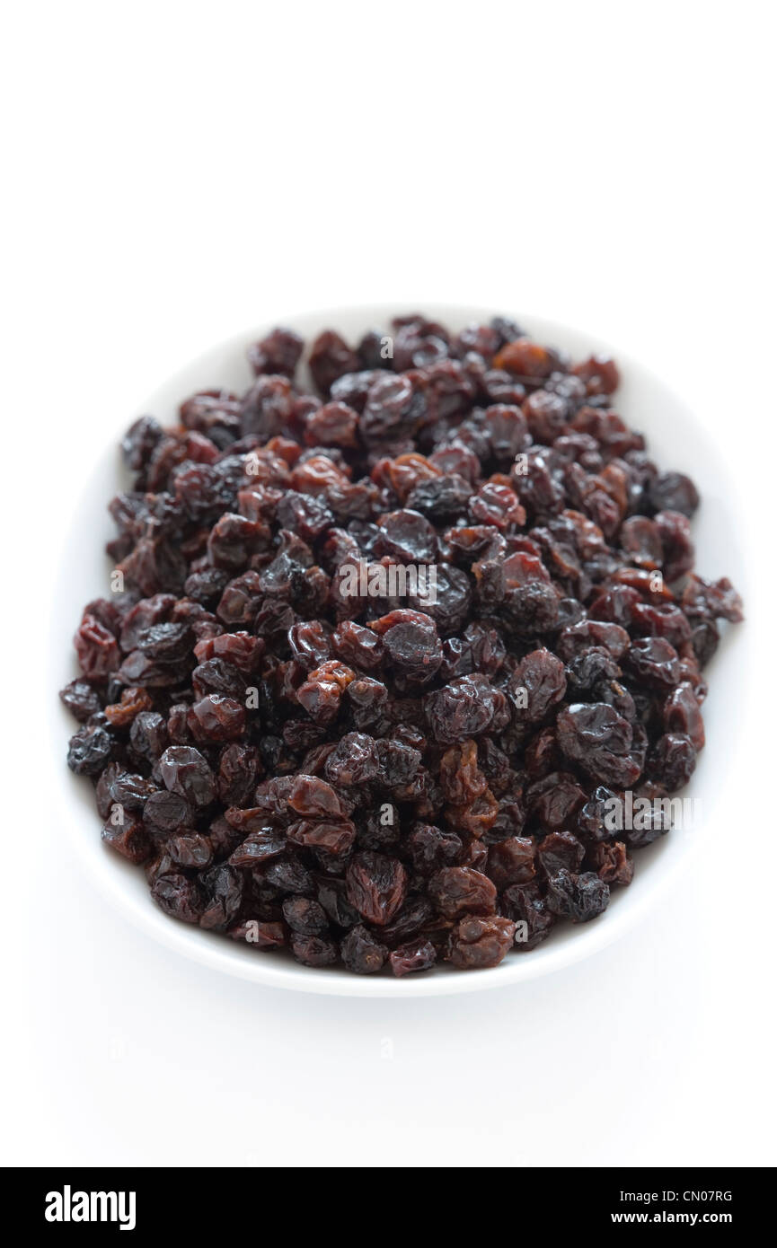 dried currants in a dish isolated Stock Photo - Alamy