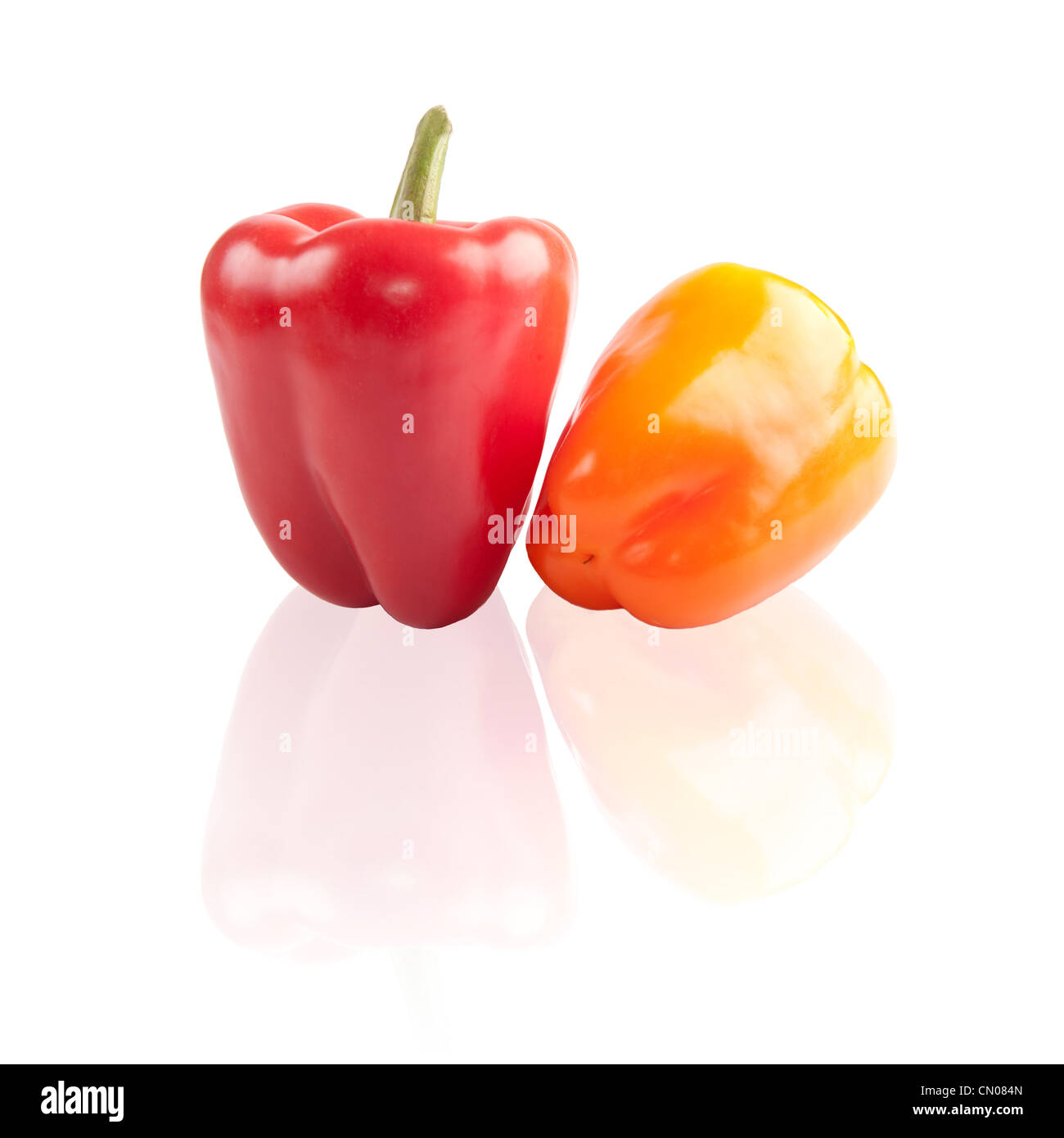 Two peppers with reflection isolated on white Stock Photo - Alamy