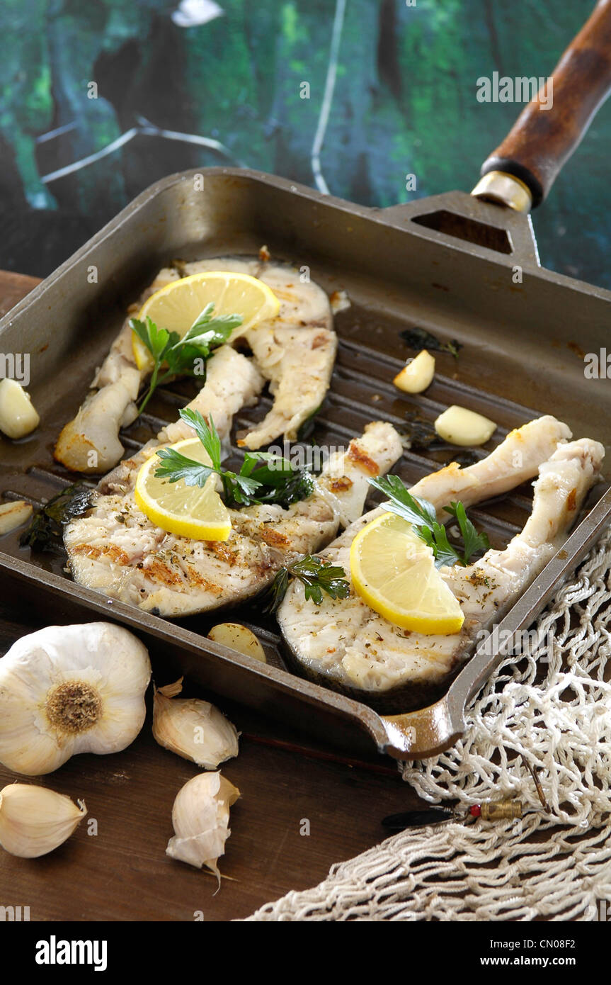 carp slices with garlic Stock Photo - Alamy