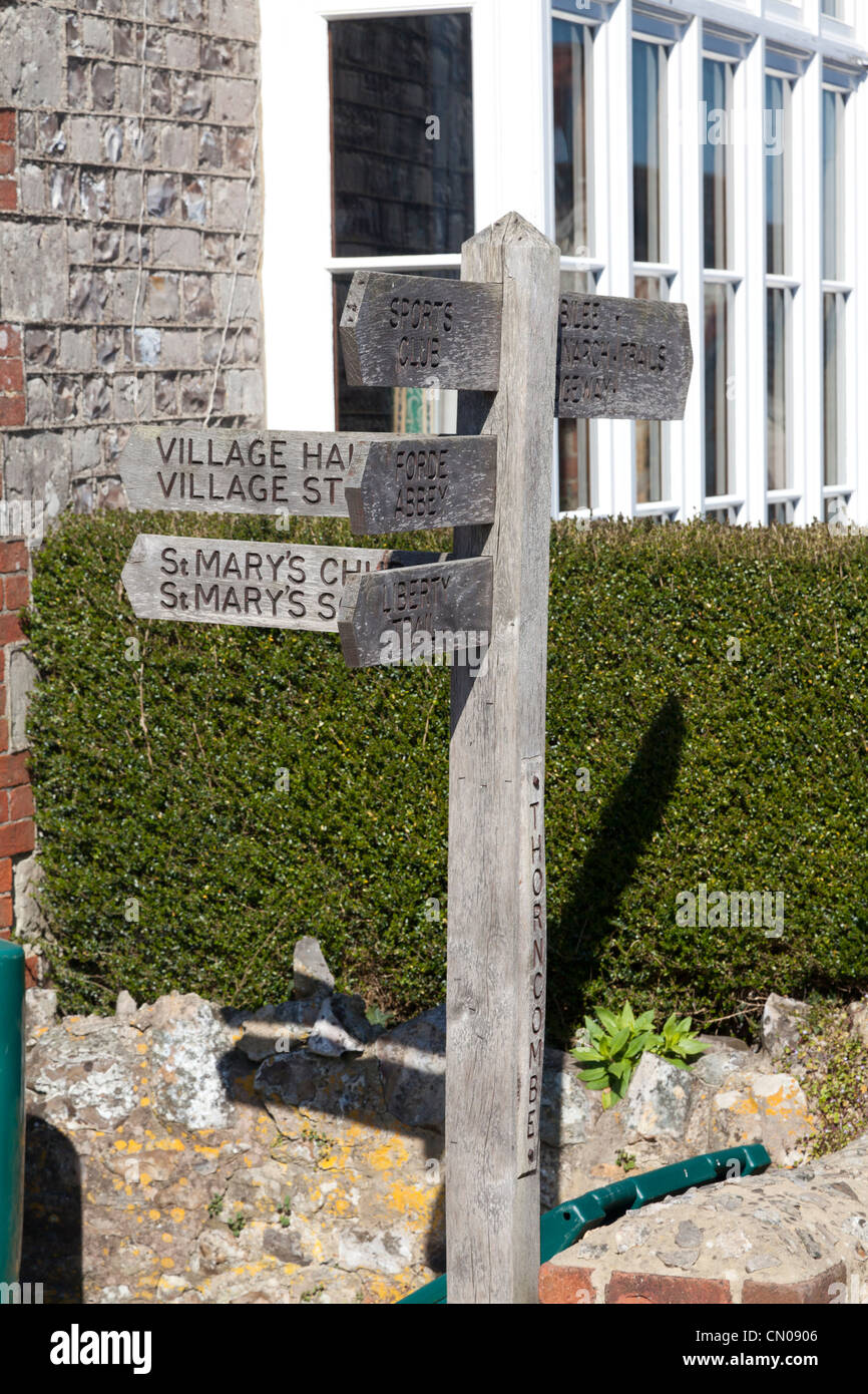 Wooden signpost in the centre of the village, Thorncombe, Dorset Stock ...