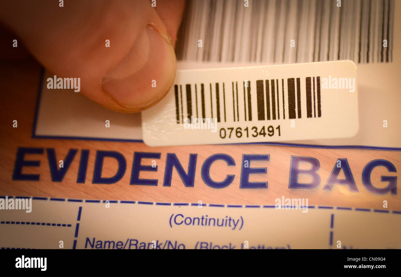 A barcode being placed on a police exhibit bag for continuity purposes ...