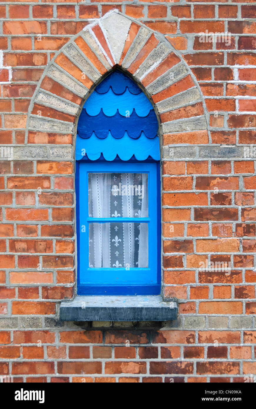 brick with blue trim window Stock Photo - Alamy