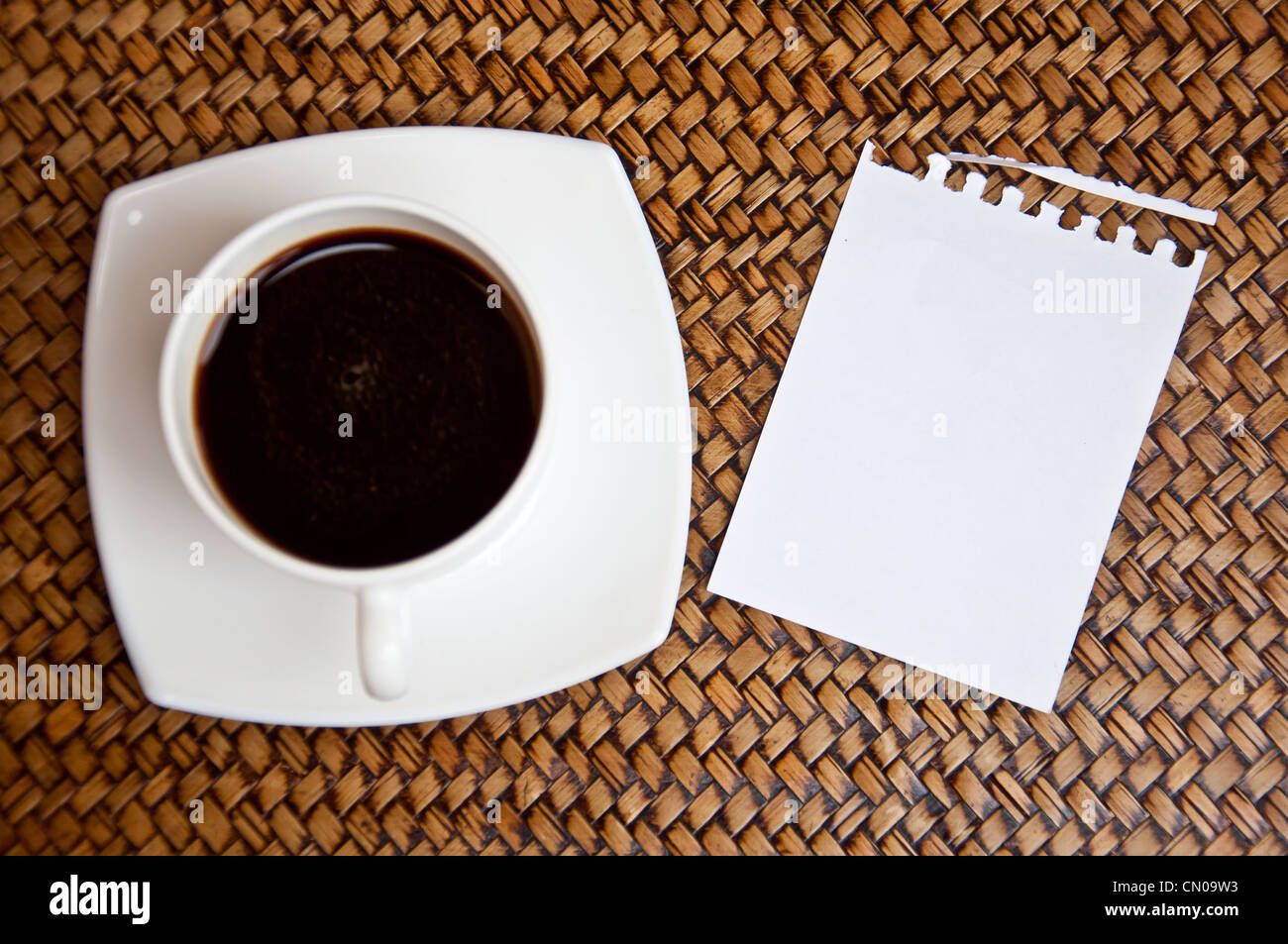 Blank paper and black coffee on sedge background Stock Photo - Alamy