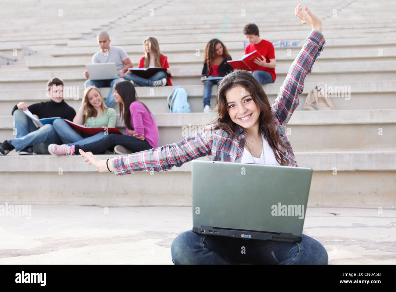 students on campus working outdoors Stock Photo - Alamy