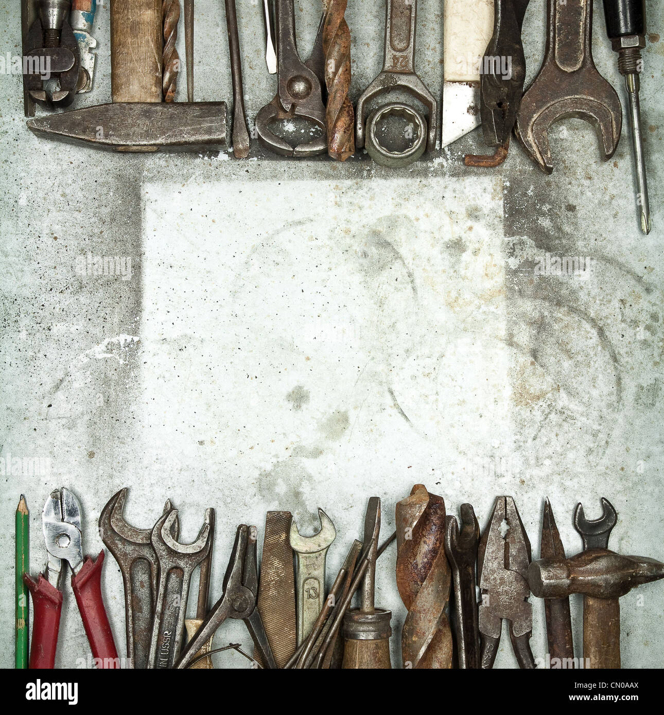 Heap of old tools on a metal background Stock Photo - Alamy