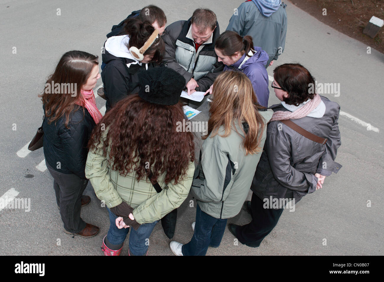 Group of People Reading a Map Stock Photo - Alamy