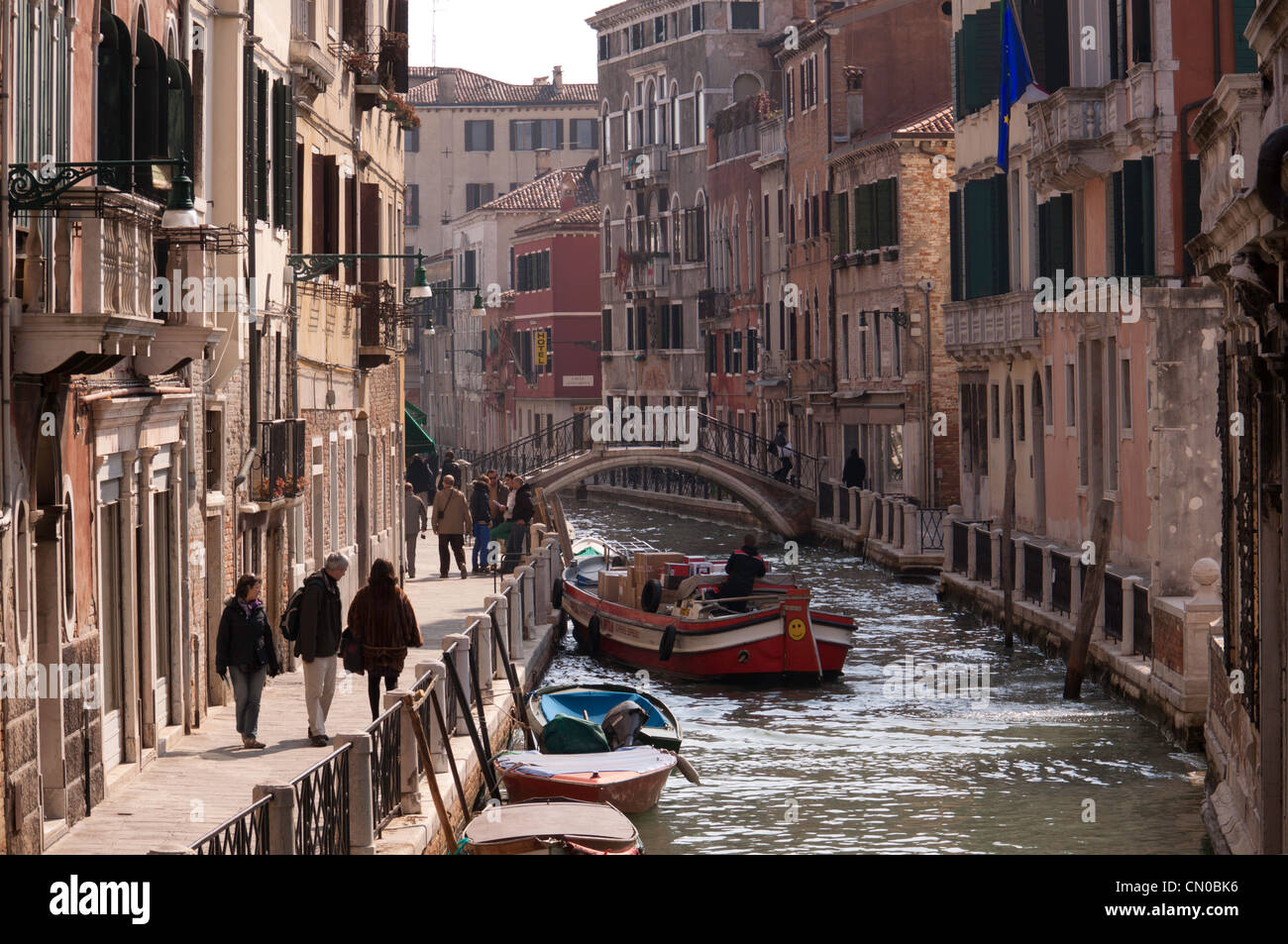 Boat delivering goods along canal Stock Photo - Alamy