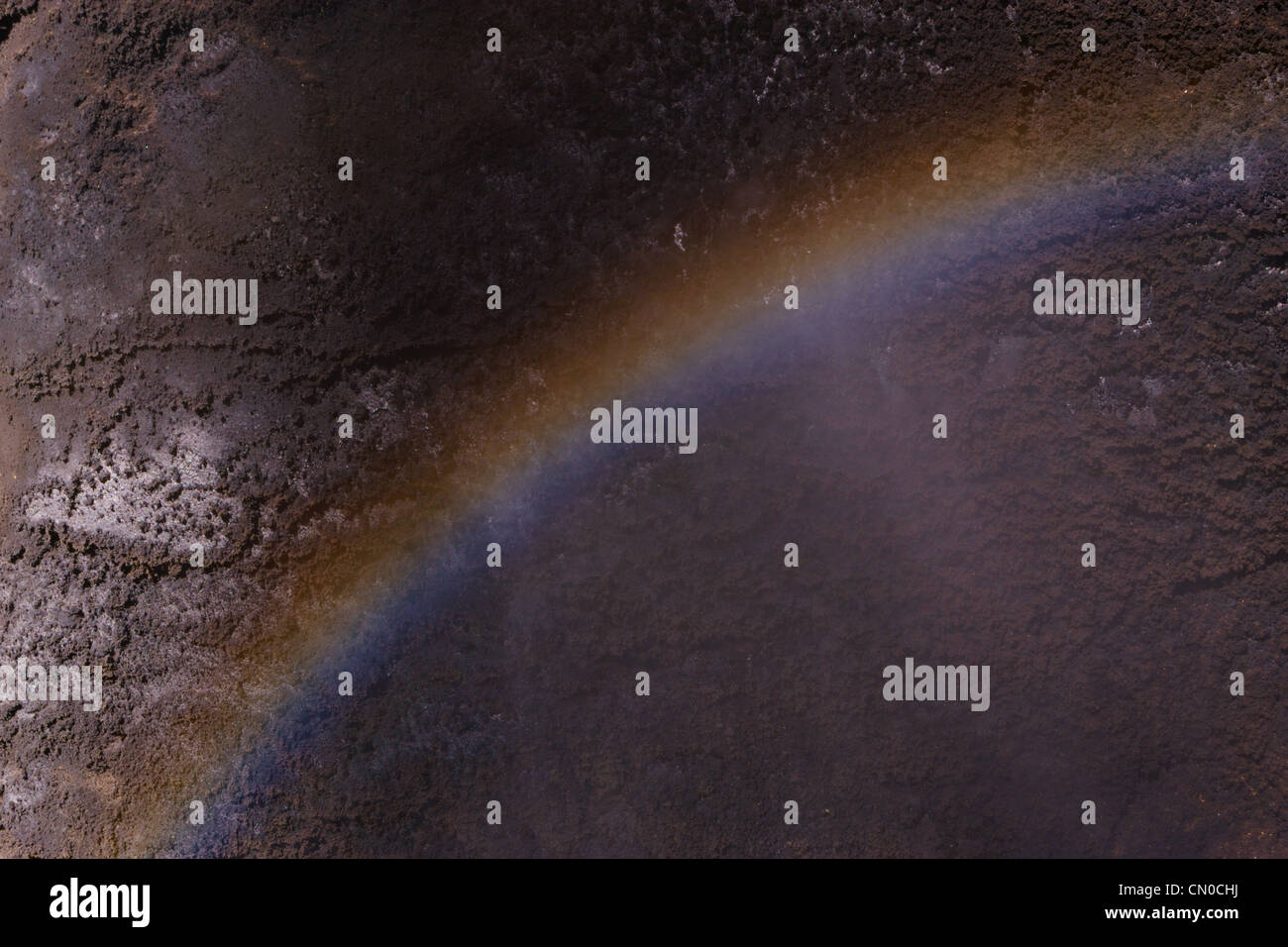 a dark rainbow textured abstract background Stock Photo - Alamy