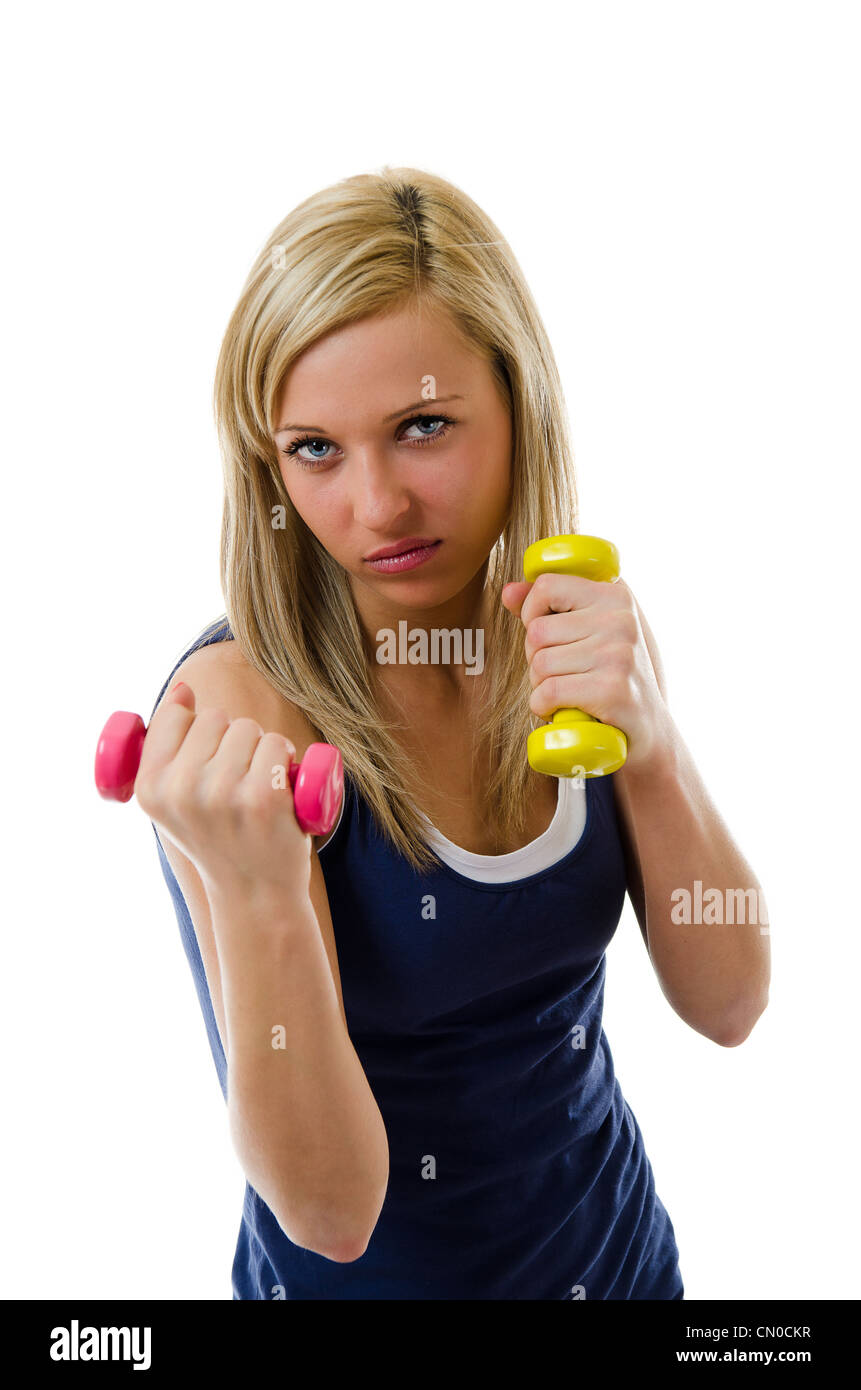 Angry looking girl training with dumbbells Stock Photo - Alamy