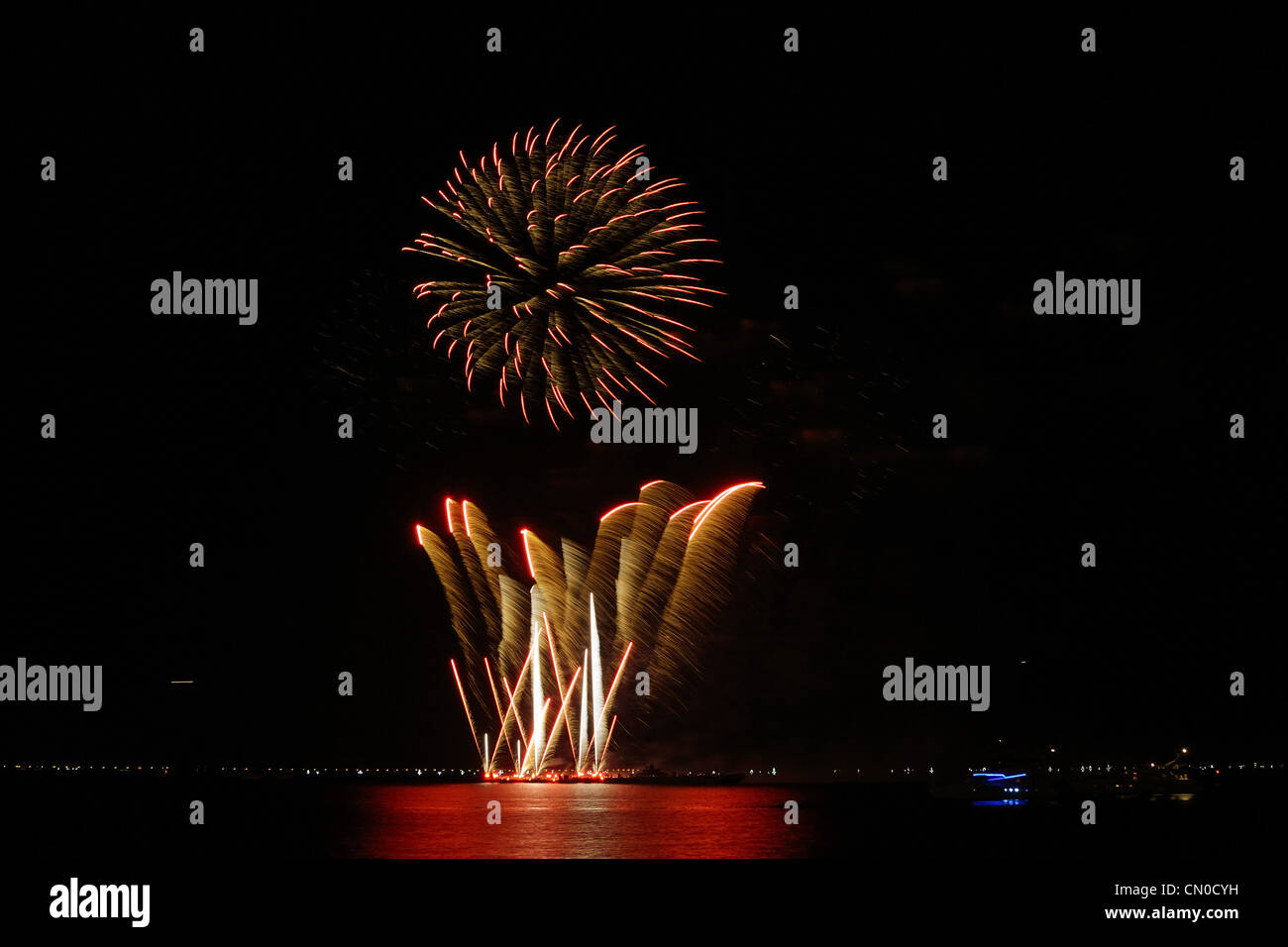 colorful huge fireworks display and reflection Stock Photo - Alamy