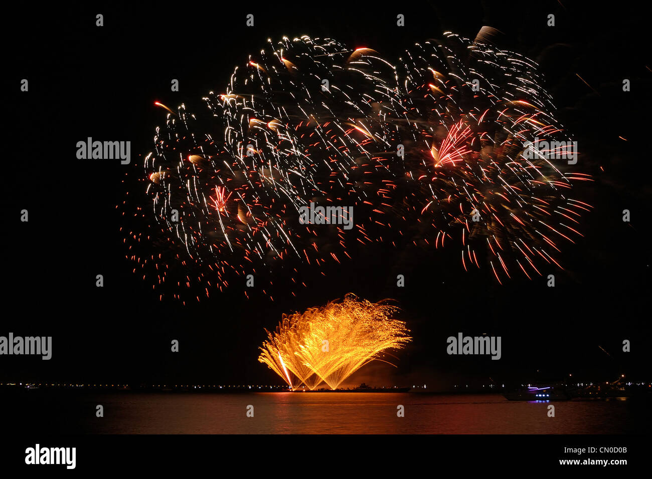 colorful huge fireworks display and reflection Stock Photo - Alamy