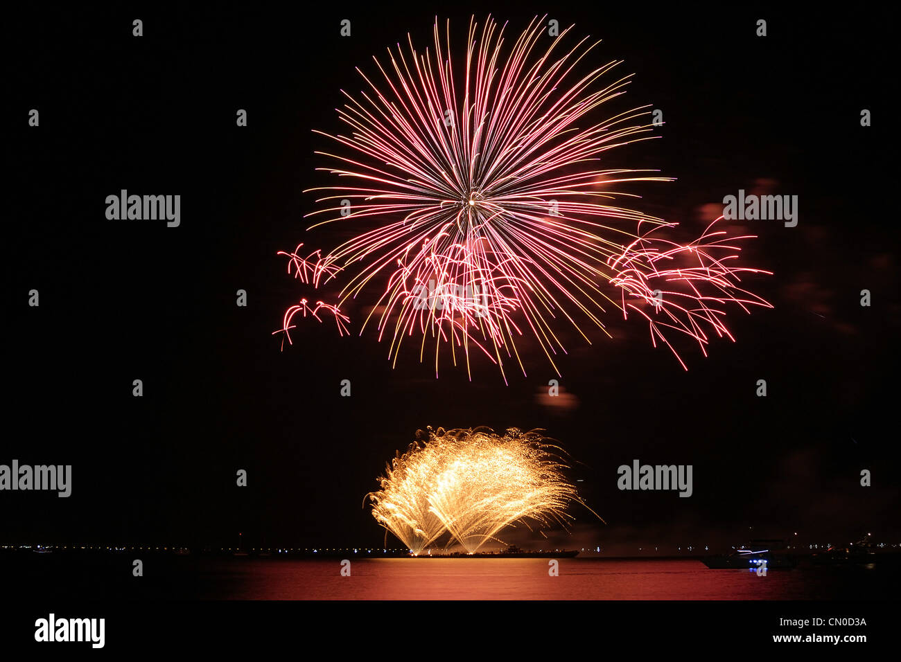 colorful huge fireworks display and reflection Stock Photo - Alamy