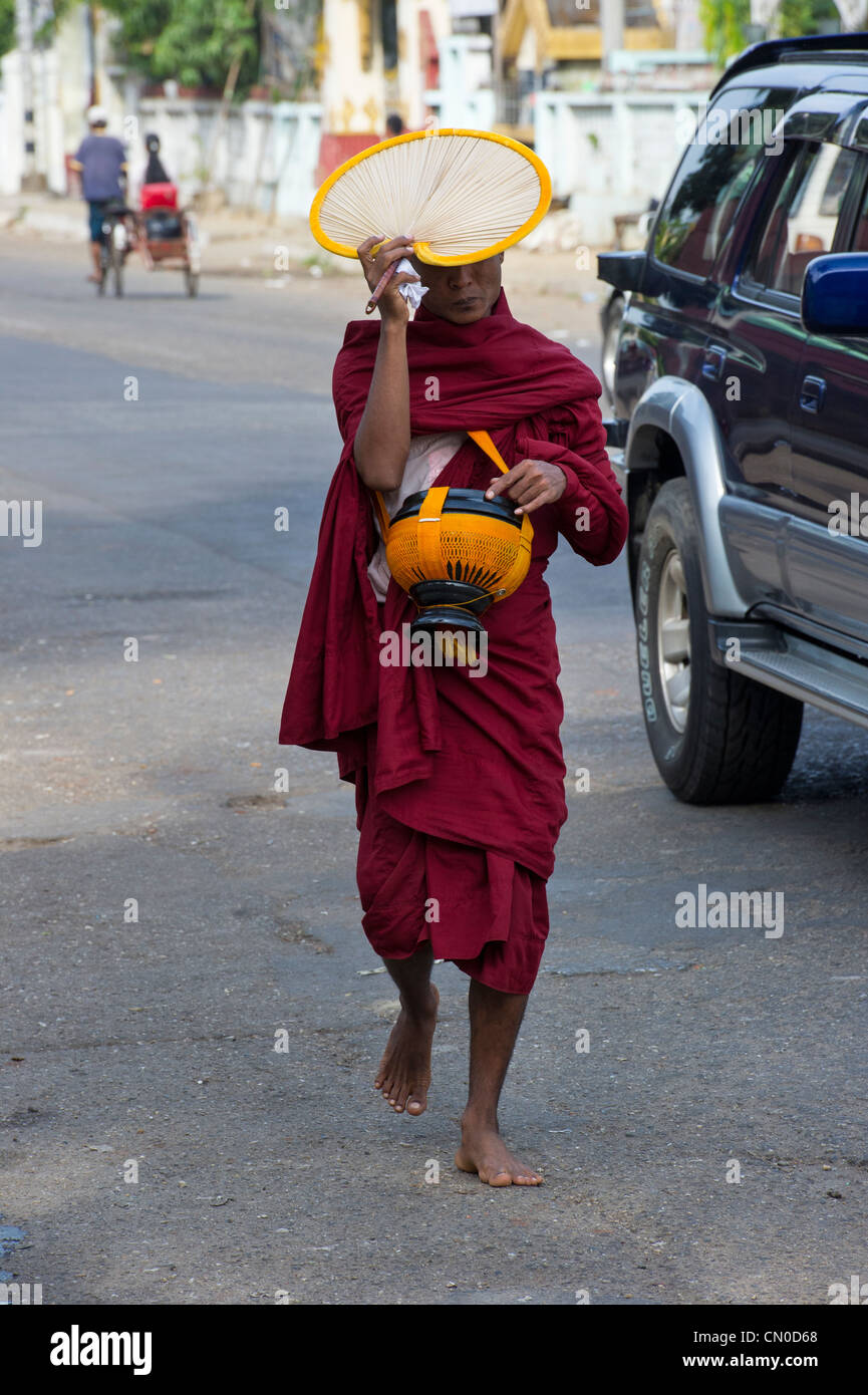Monk on a street in Yangon Stock Photo - Alamy