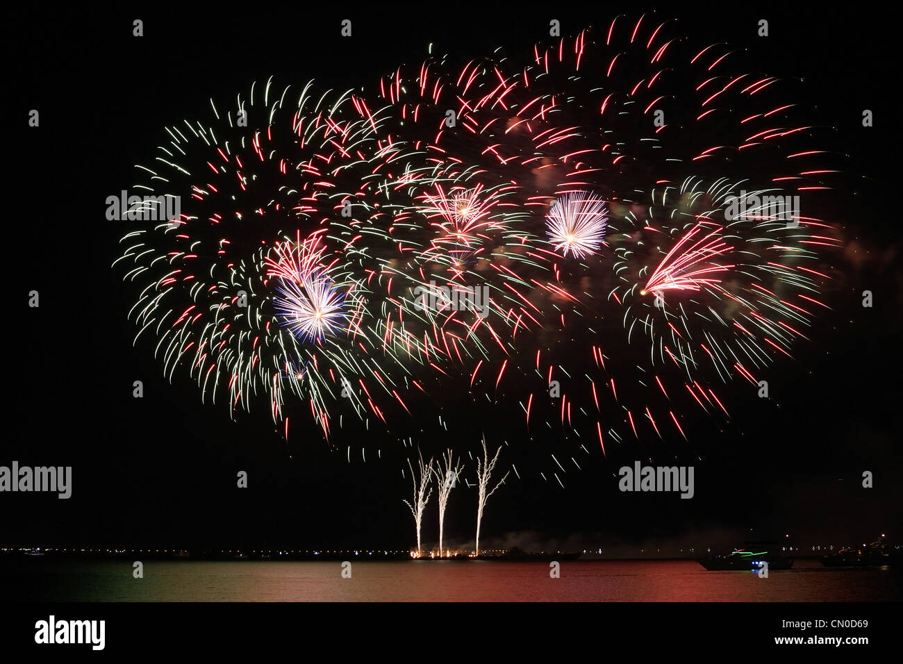 colorful huge fireworks display and reflection Stock Photo - Alamy