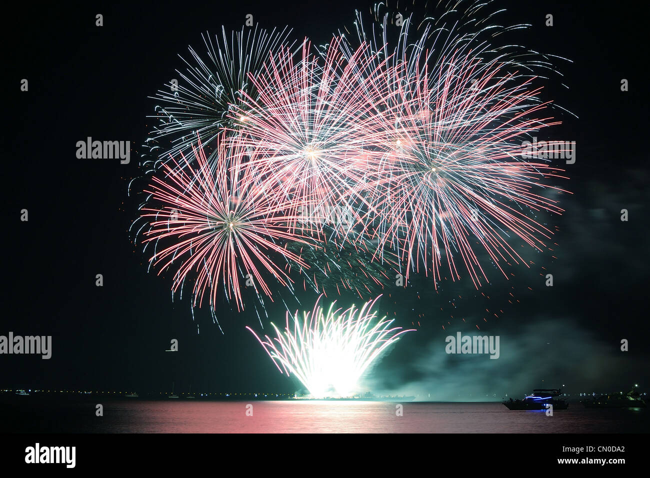 colorful huge fireworks display and reflection Stock Photo - Alamy