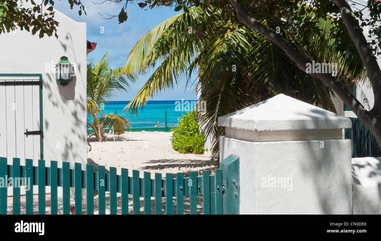 View of the beautiful Caribbean beach through two structures of a home ...