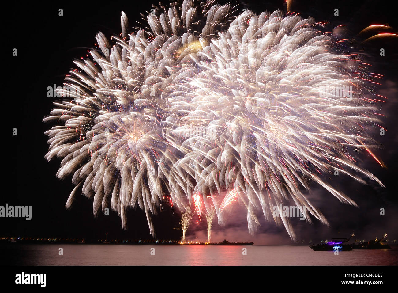 colorful huge fireworks display and reflection Stock Photo - Alamy