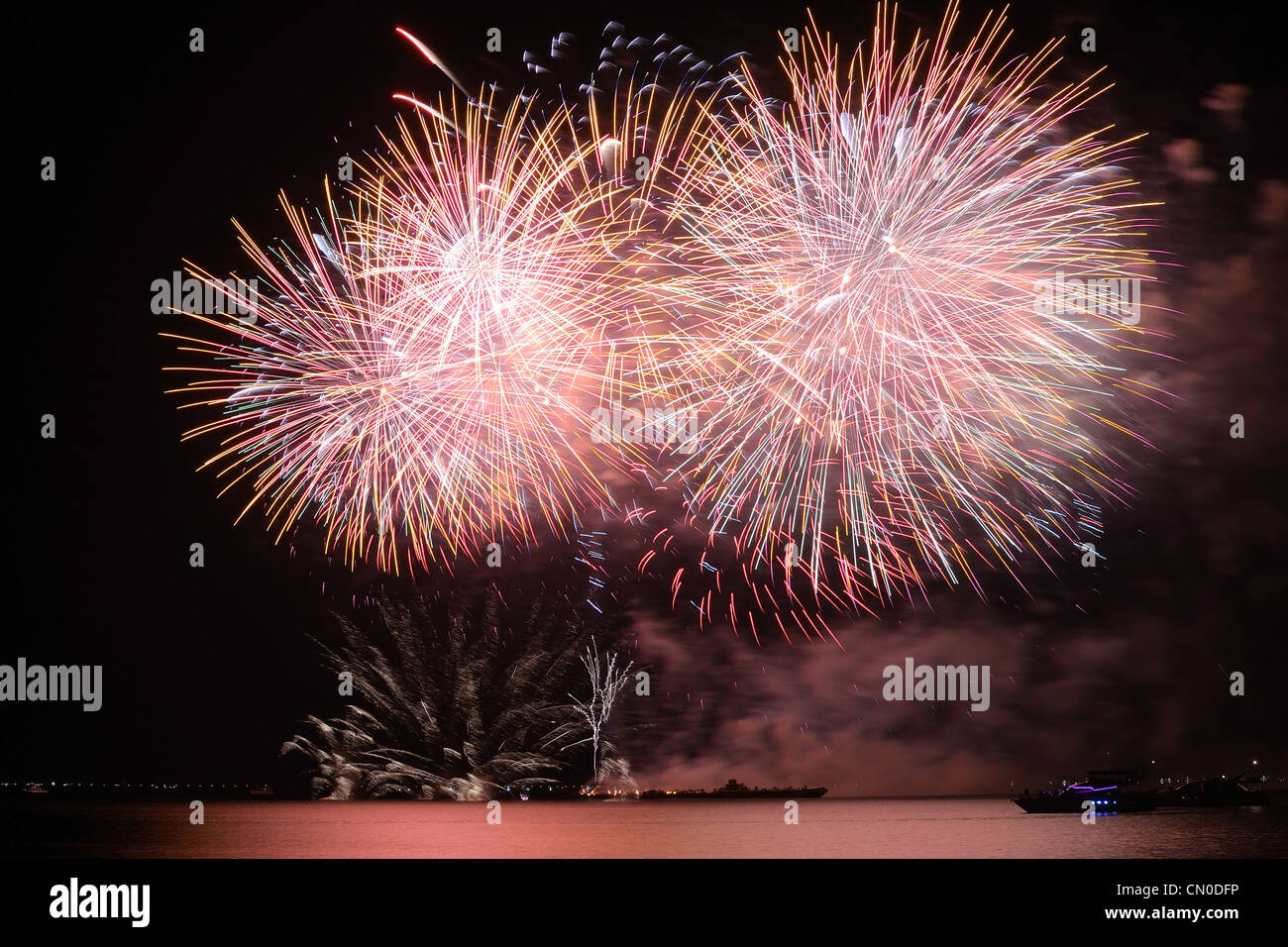 colorful huge fireworks display and reflection Stock Photo - Alamy