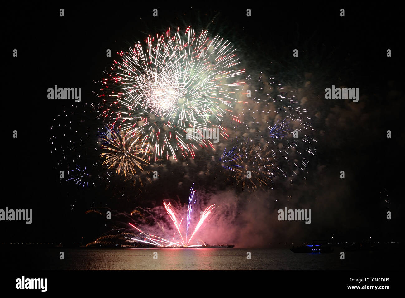 colorful huge fireworks display and reflection Stock Photo - Alamy