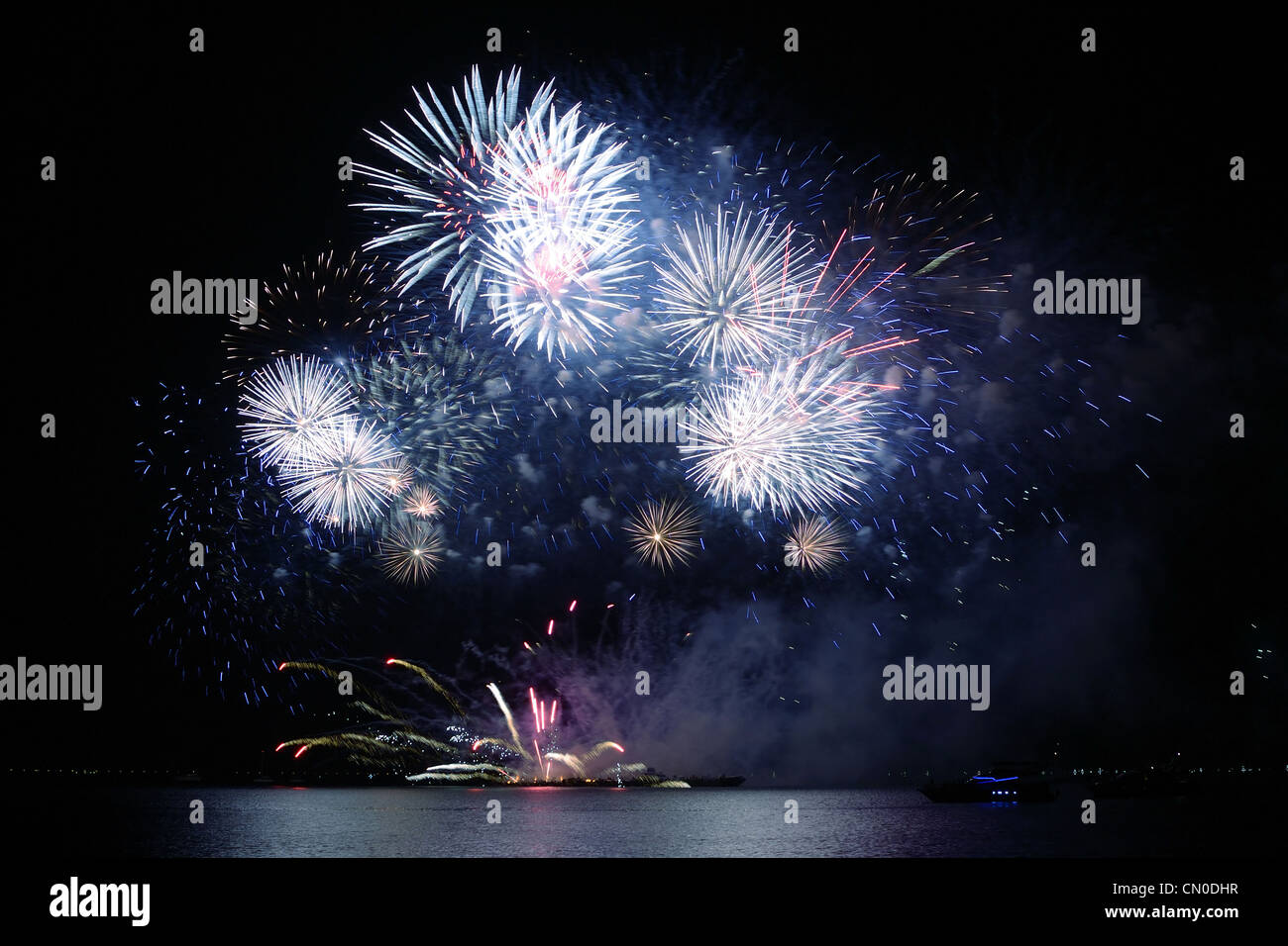 colorful huge fireworks display and reflection Stock Photo - Alamy