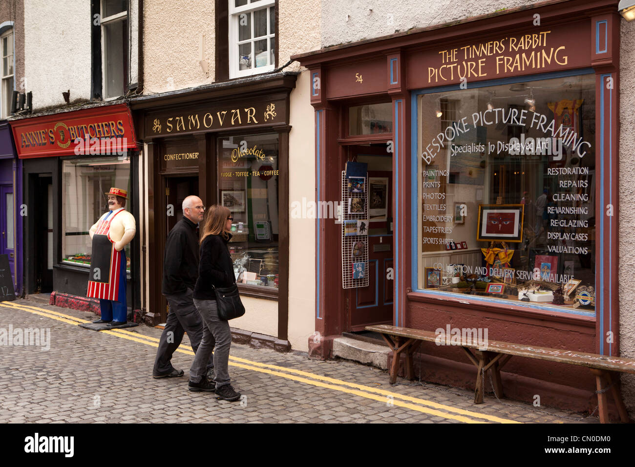 UK, Cumbria, Ulverston, Market Street, locally owned specialist shops ...