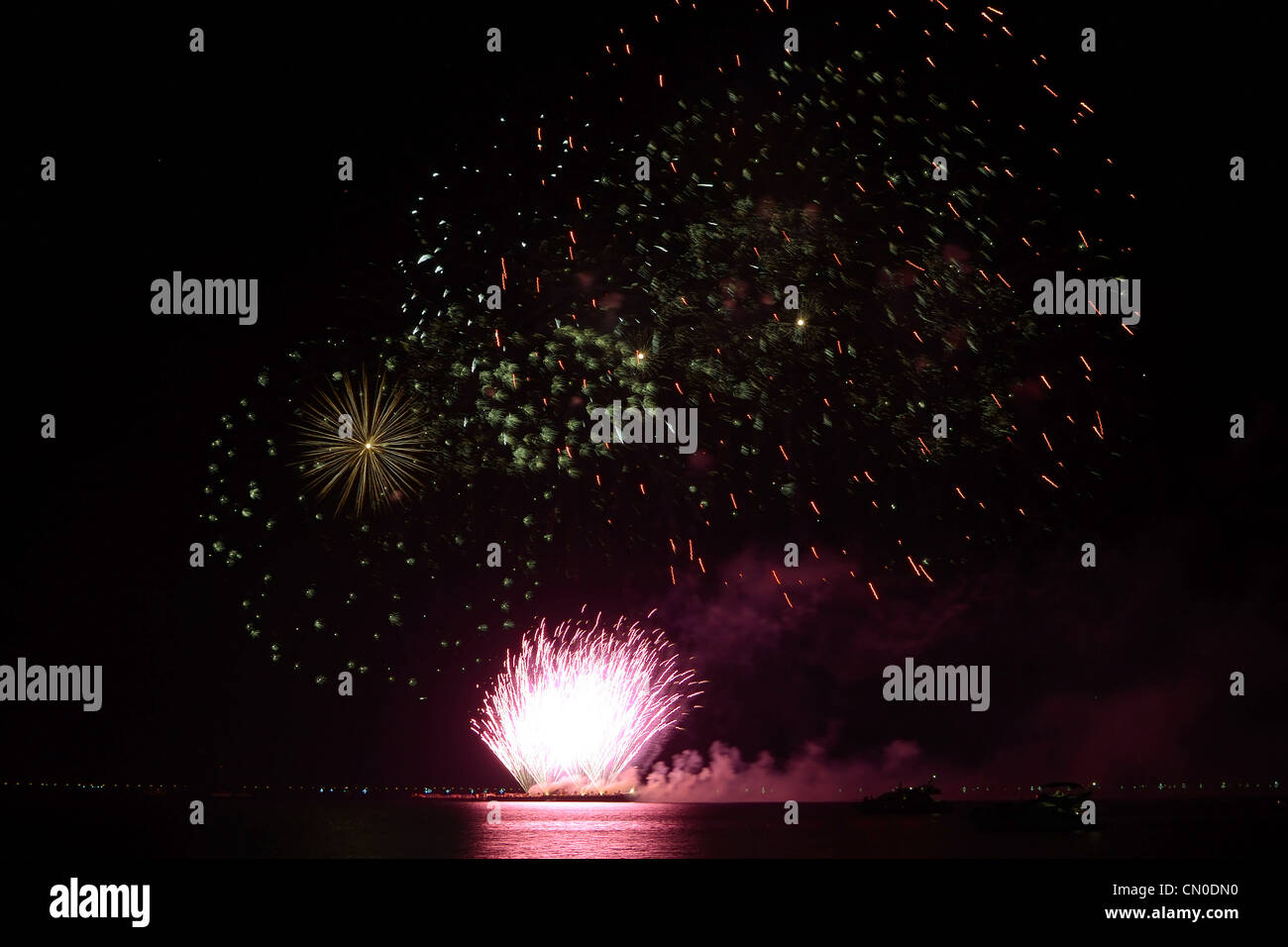 colorful huge fireworks display and reflection Stock Photo - Alamy