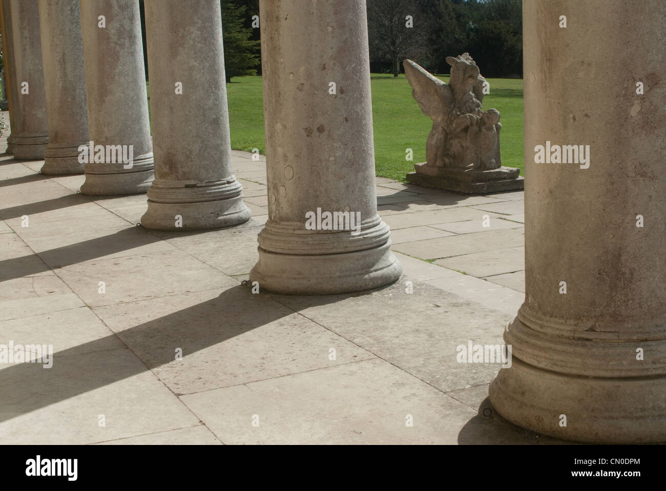 Columns and winged statue at an English Country house Stock Photo - Alamy