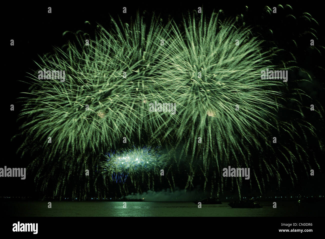 colorful huge fireworks display and reflection Stock Photo - Alamy