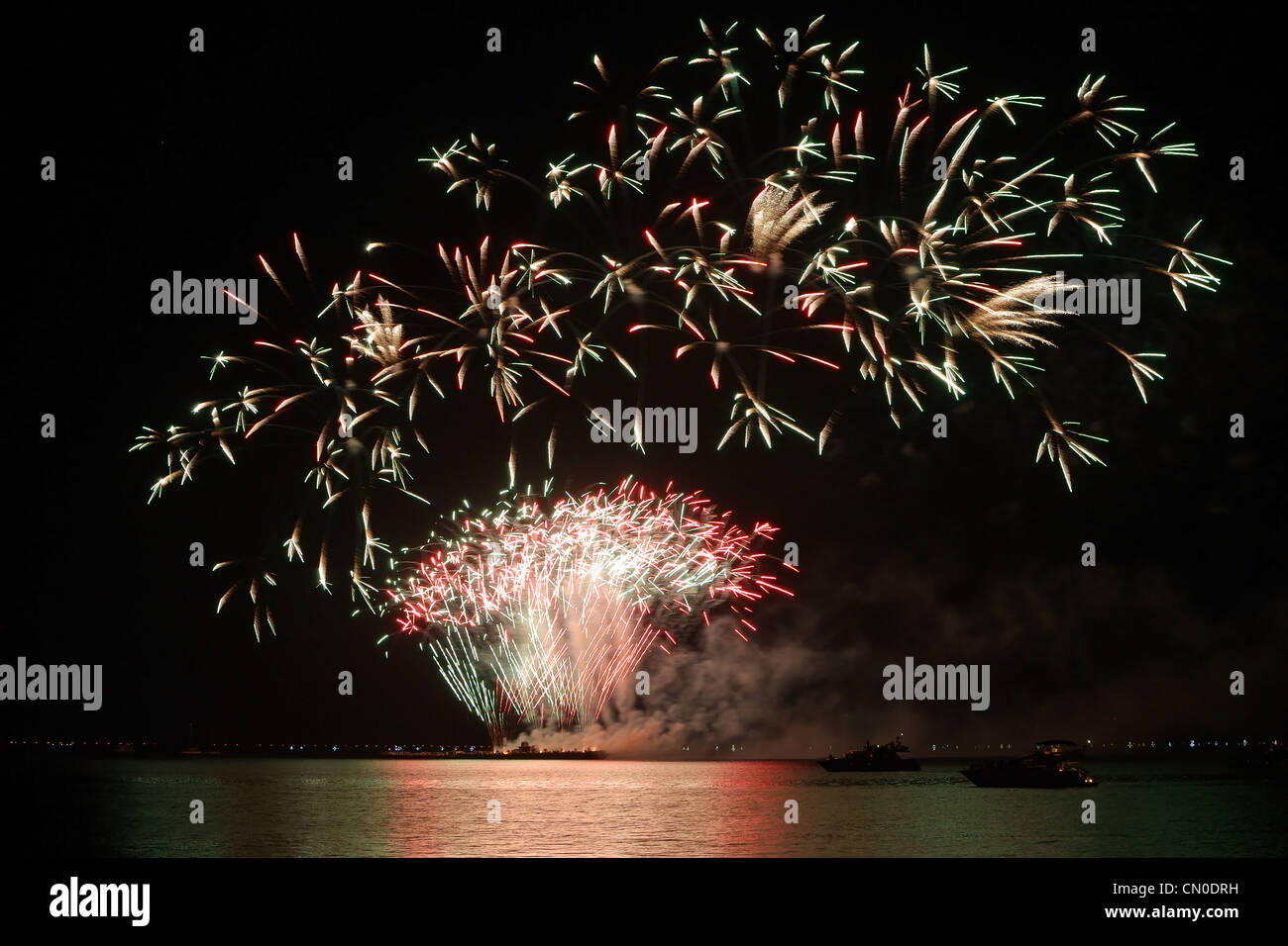 colorful huge fireworks display and reflection Stock Photo - Alamy