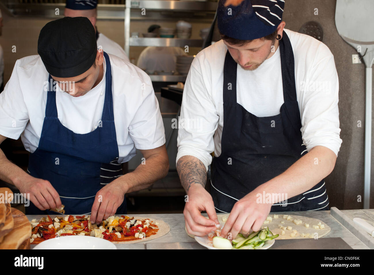 Chefs preparing a meal in Falmouth Cornwall UK Stock Photo - Alamy